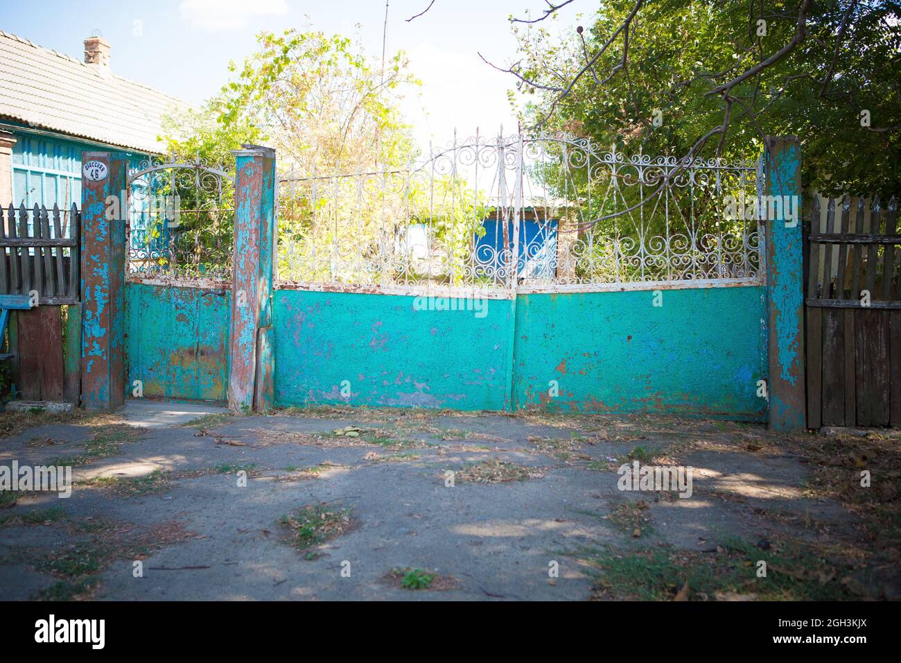 old rickety gates. Old rusty gate in an abandoned house. Broken gate ...