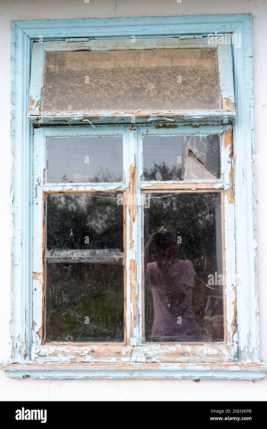 Old windows. Old windows in the wall of an abandoned house. Windows ...