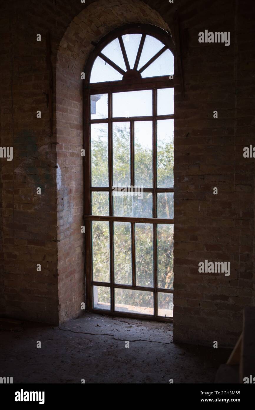 Old windows. Old windows in the wall of an abandoned house. Windows ...