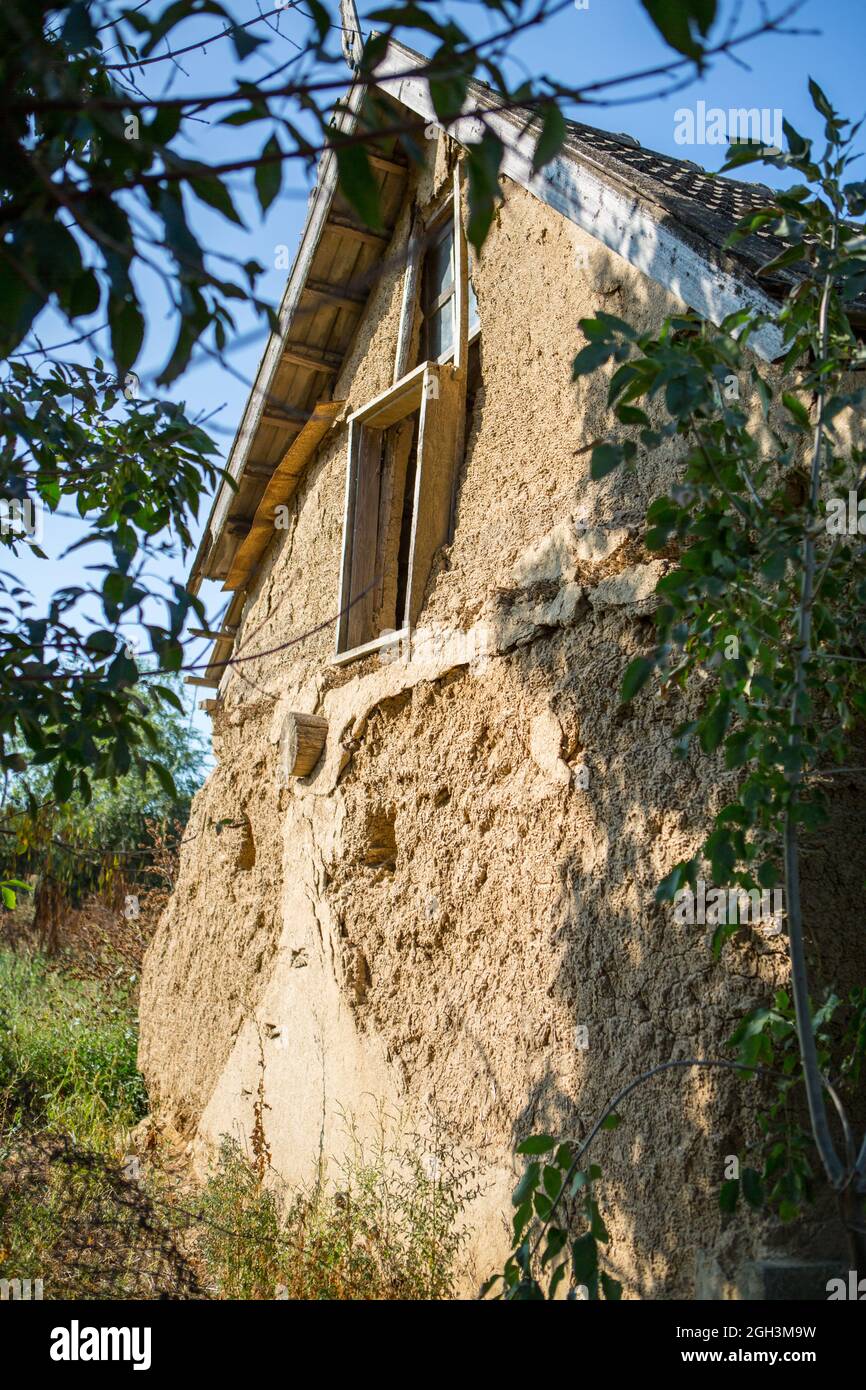 Ruined old house. Ruins of house made of shell rock, straw and clay in ...