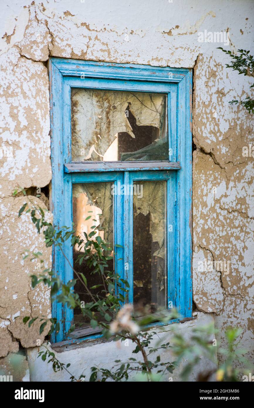Old windows. Old windows in the wall of an abandoned house. Windows ...