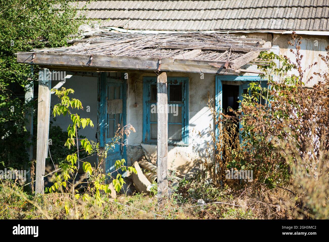 Part of Ruined old house. Ruins of a house made of shell rock, straw ...