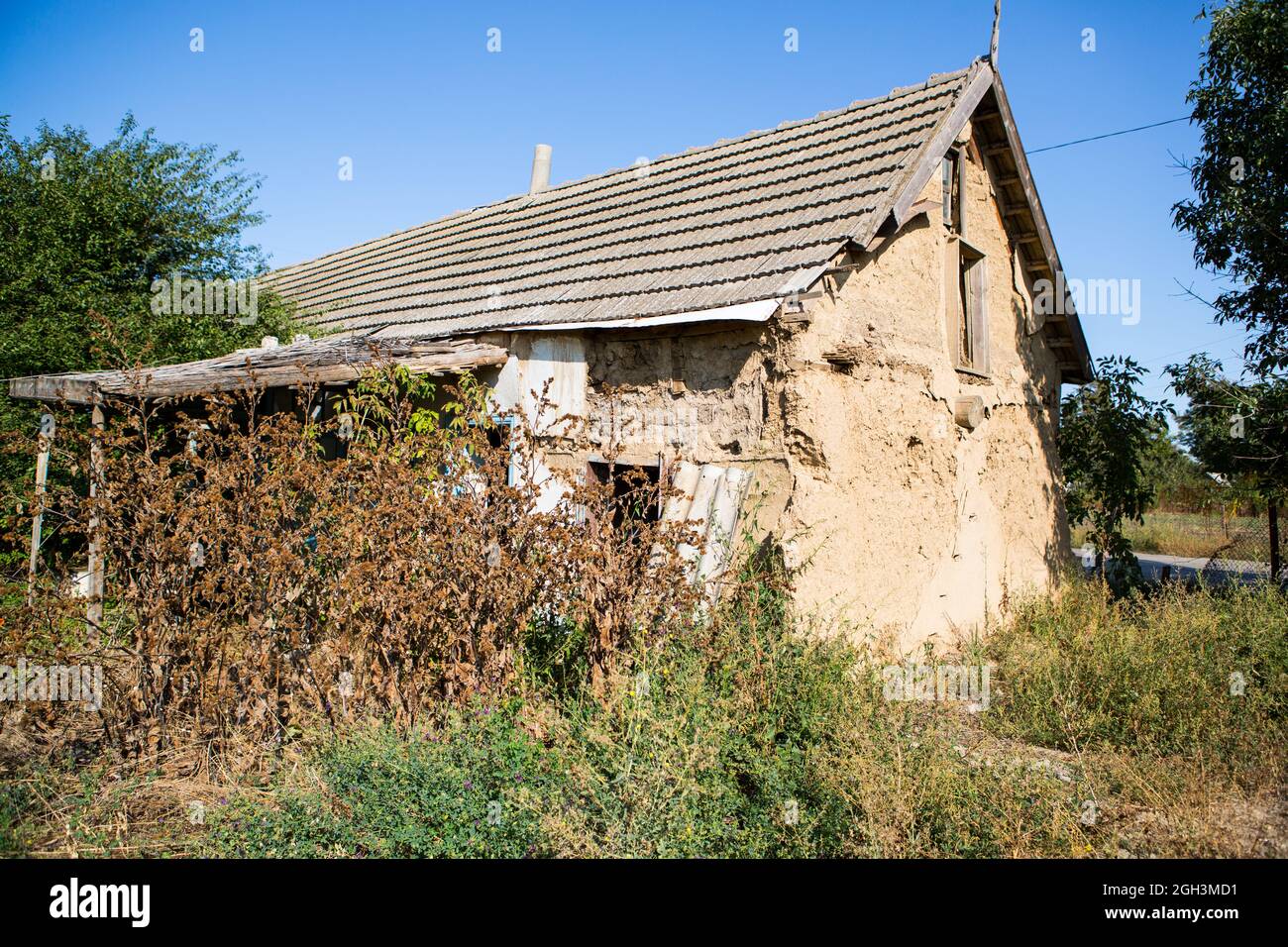 Ruined old house. Ruins of house made of shell rock, straw and clay in ...