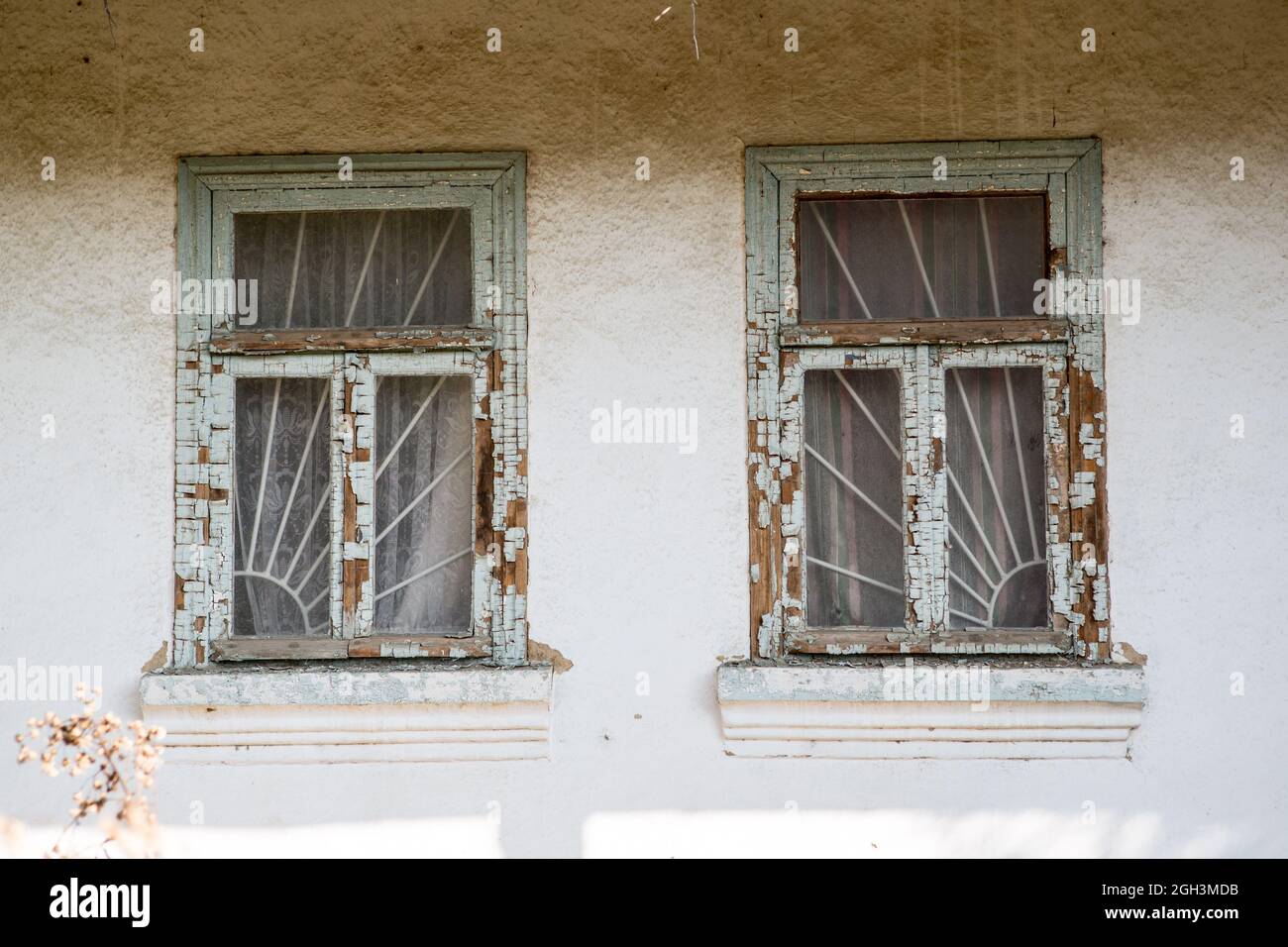 Old windows. Old windows in the wall of an abandoned house. Windows ...