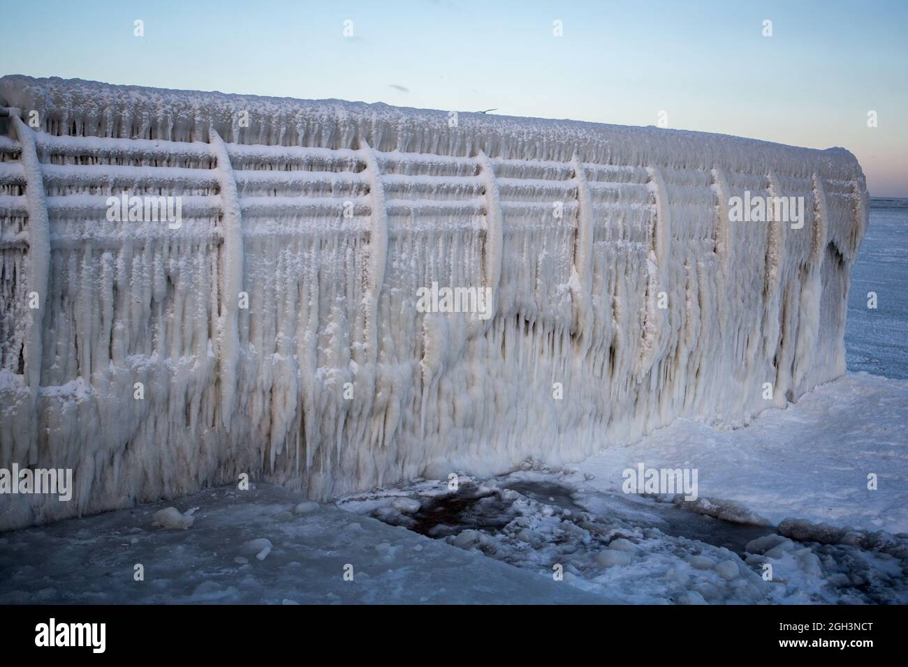 Icing. Winter natural disaster icing sea promenade after winter storm ...