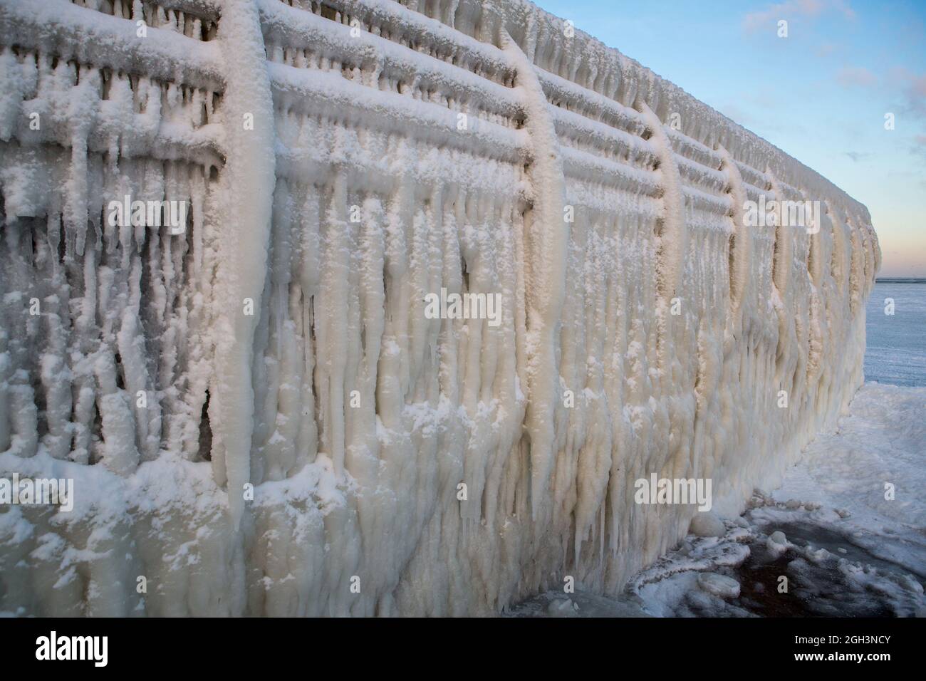 Icing. Winter natural disaster icing sea promenade after winter storm ...