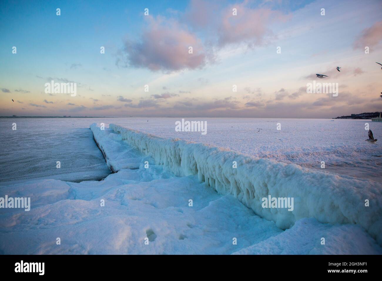 Icing. Winter natural disaster icing sea promenade after winter storm ...