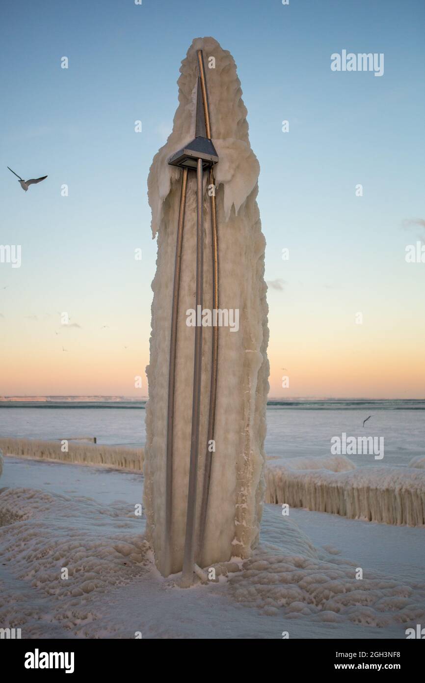 Icing. Winter natural disaster icing sea promenade after winter storm ...