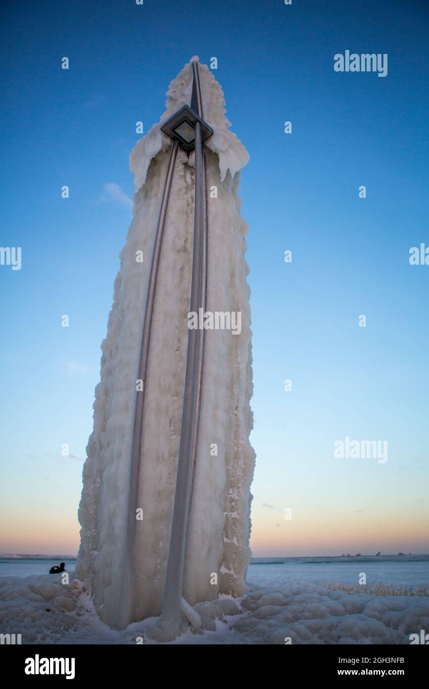 Icing. Winter natural disaster icing sea promenade after winter storm ...