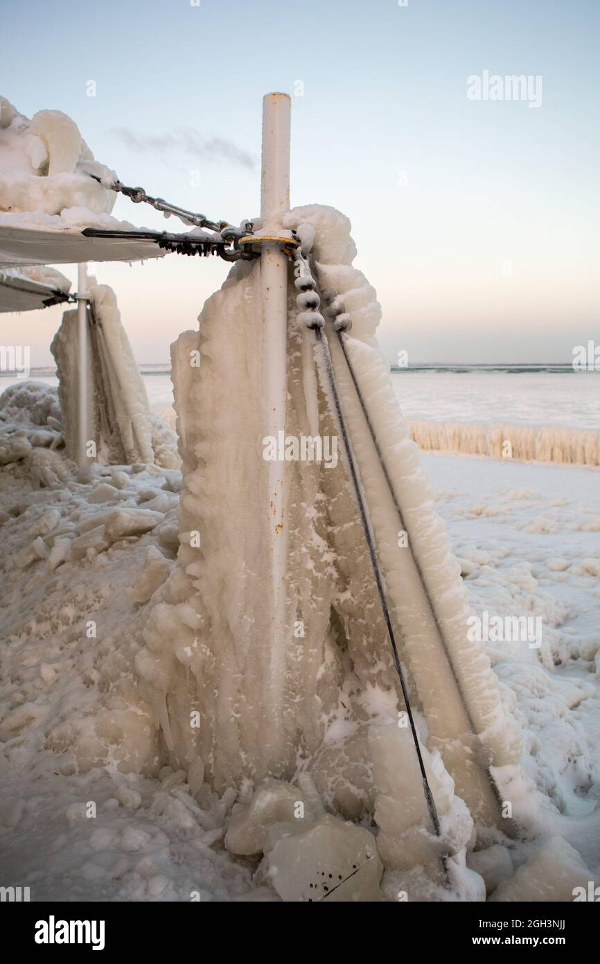 Icing. Winter natural disaster icing sea promenade after winter storm ...