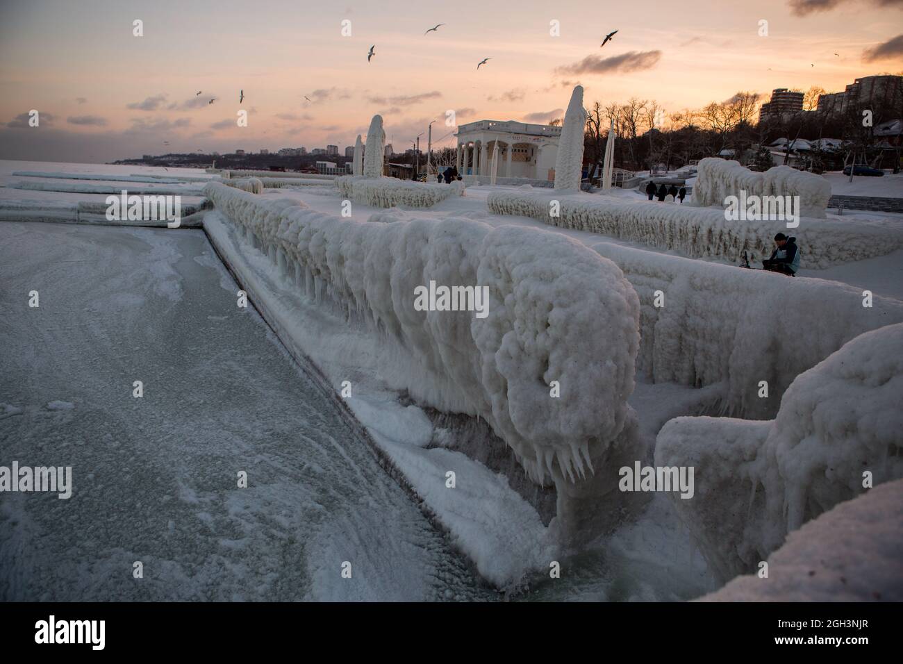 Icing. Winter natural disaster icing sea promenade after winter storm ...