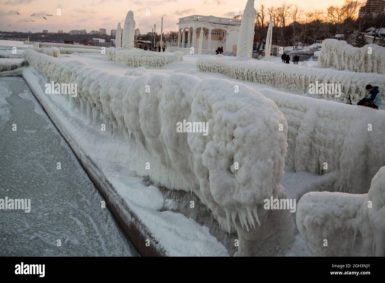 Icing. Winter natural disaster icing sea promenade after winter storm ...