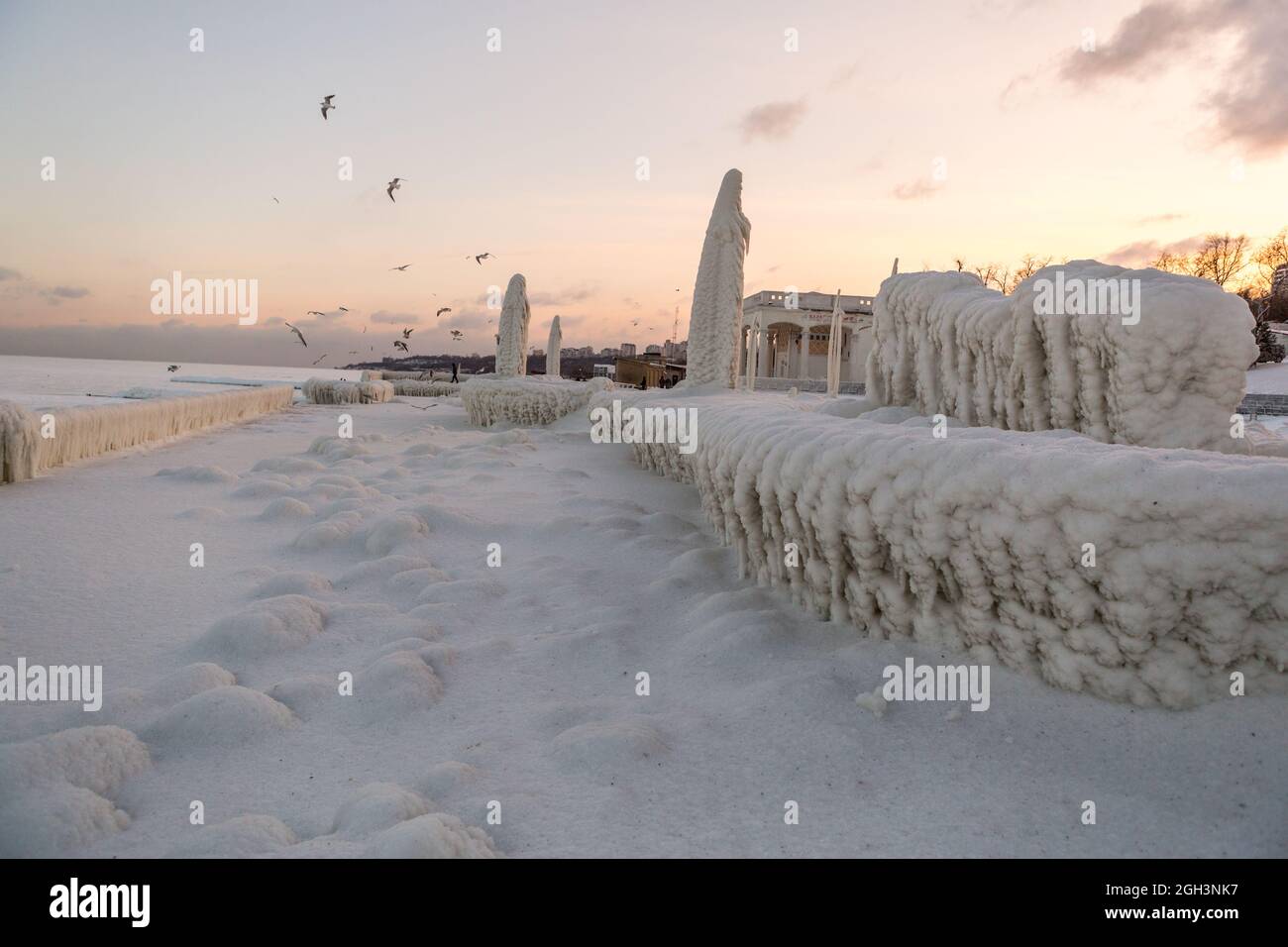 Icing. Winter natural disaster icing sea promenade after winter storm ...