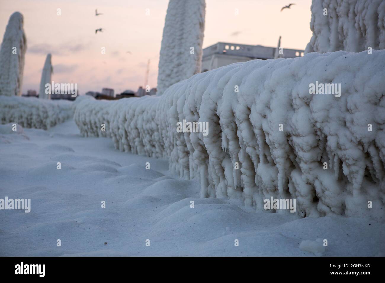 Icing. Winter natural disaster icing sea promenade after winter storm ...