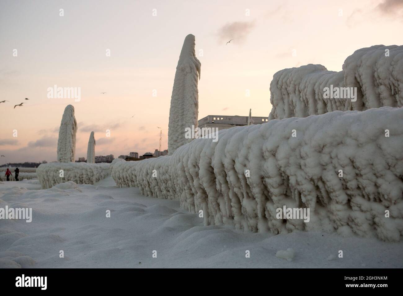 Icing. Winter natural disaster icing sea promenade after winter storm ...