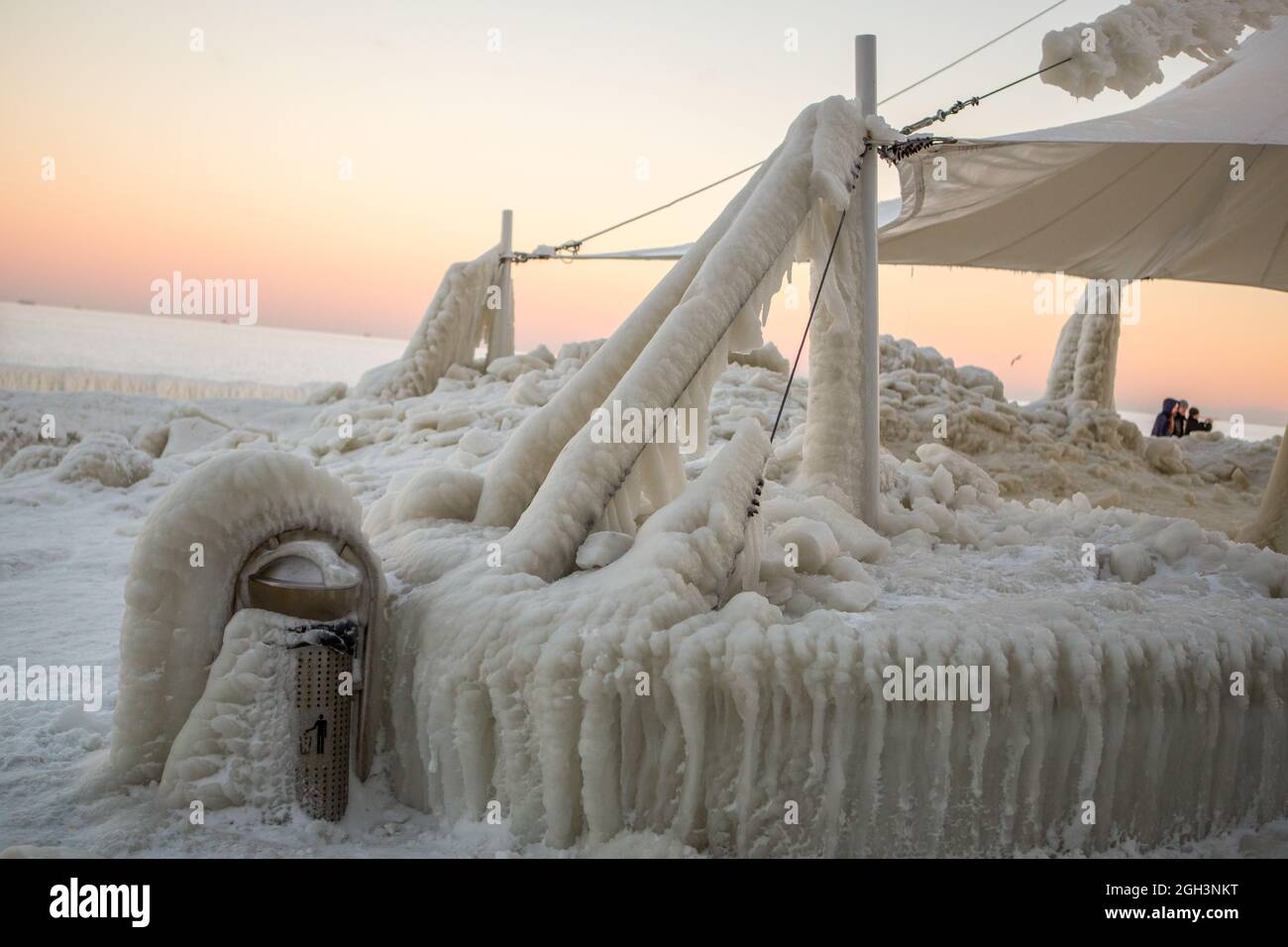 Icing. Winter natural disaster icing sea promenade after winter storm ...