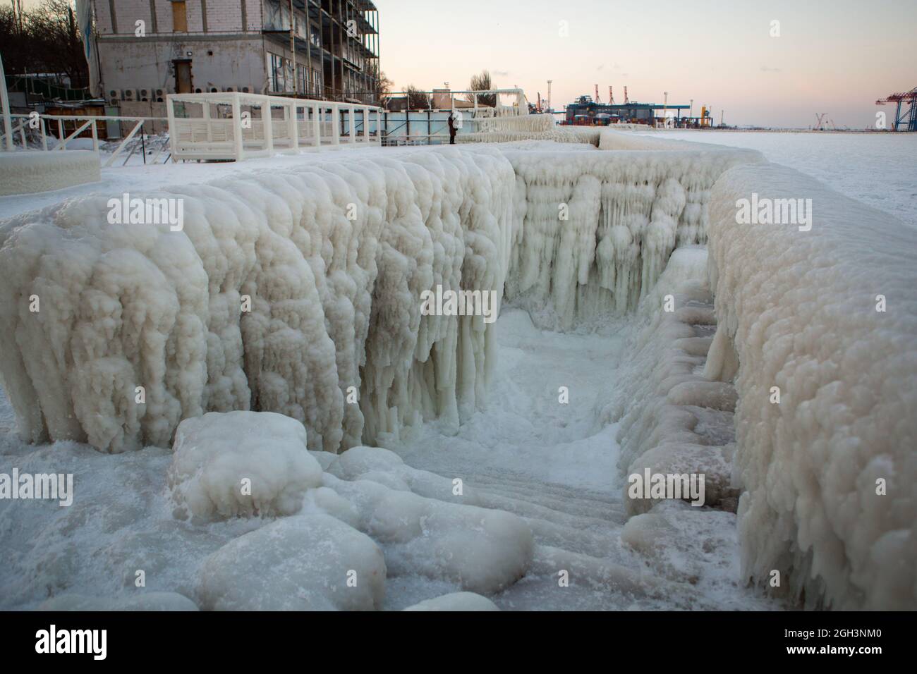 Icing. Winter natural disaster icing sea promenade after winter storm ...