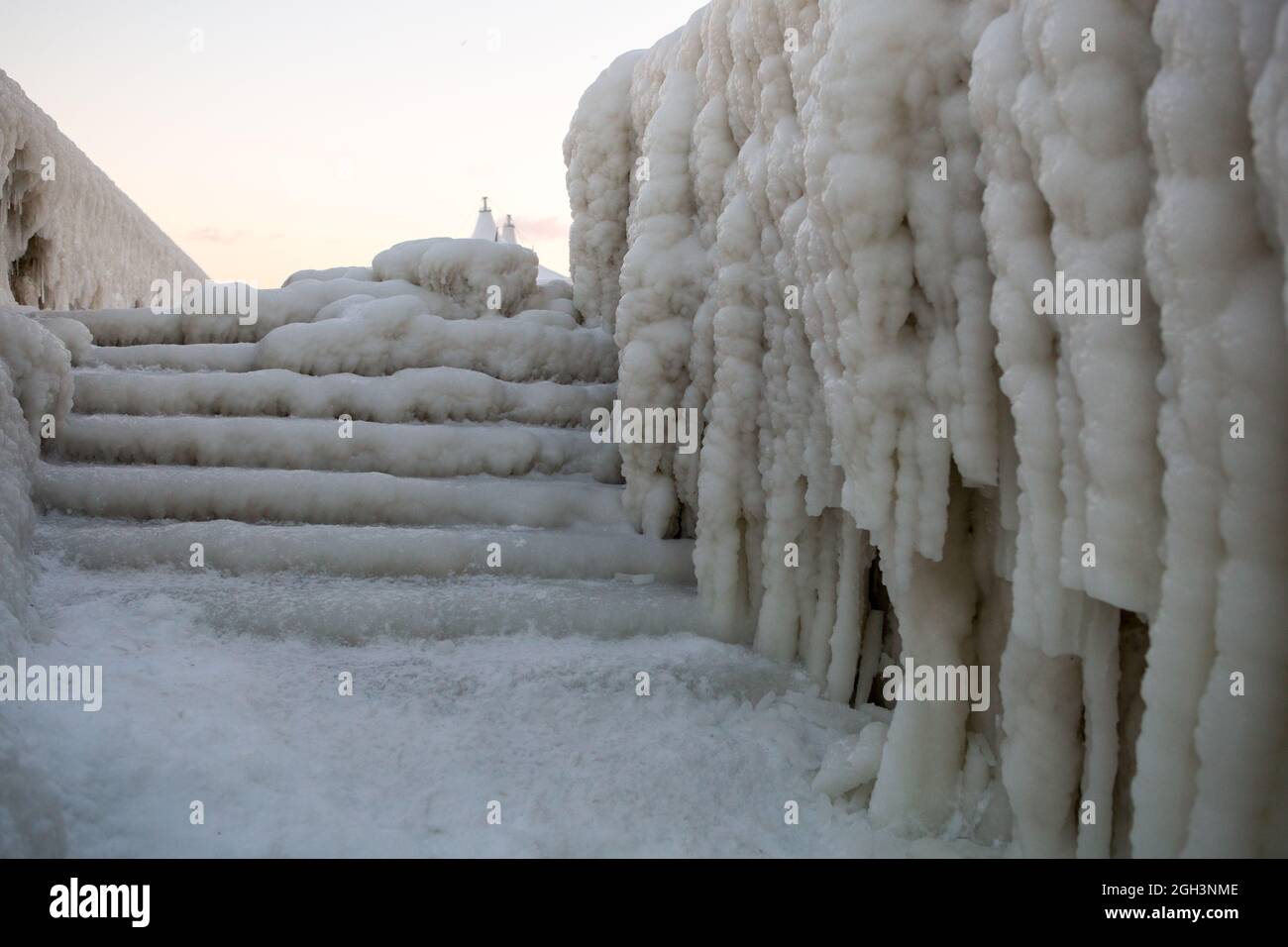 Icing. Winter natural disaster icing sea promenade after winter storm ...