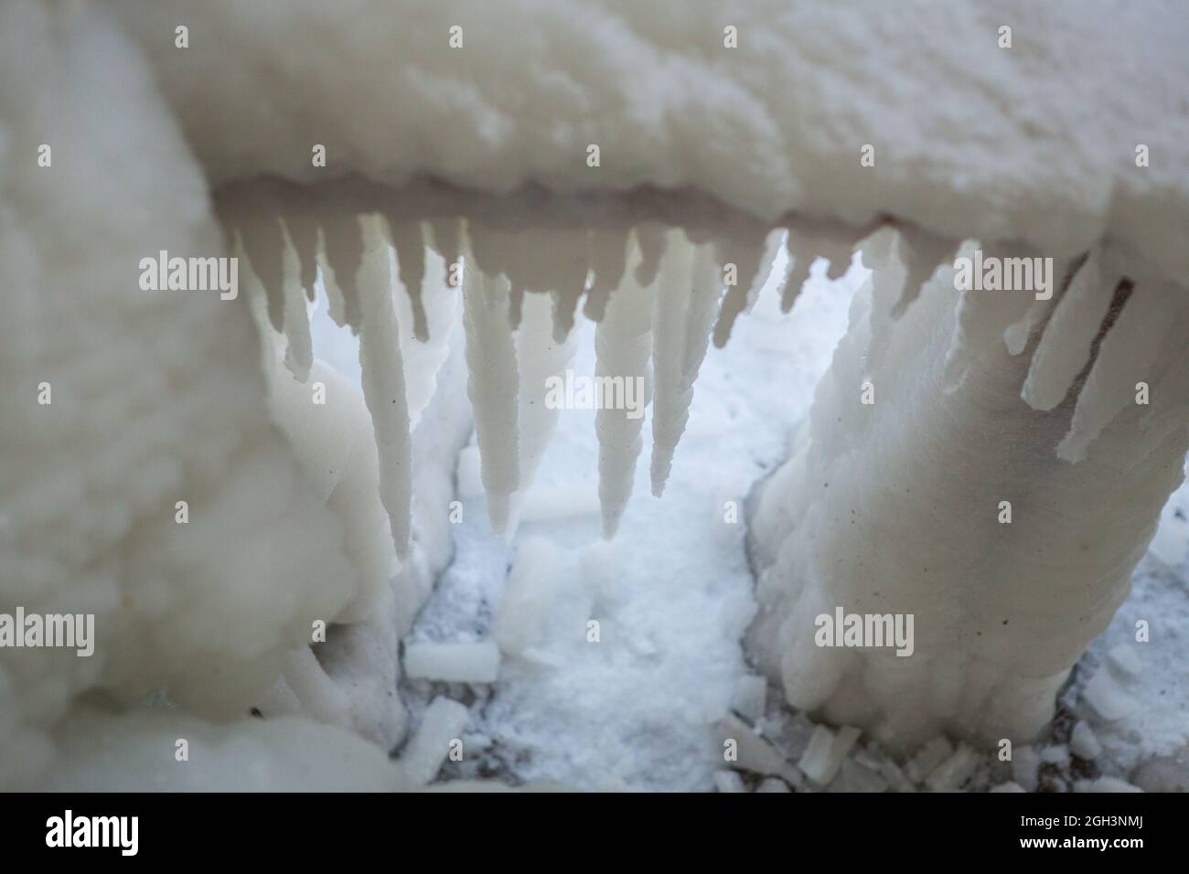 Icing. Winter natural disaster icing sea promenade after winter storm ...