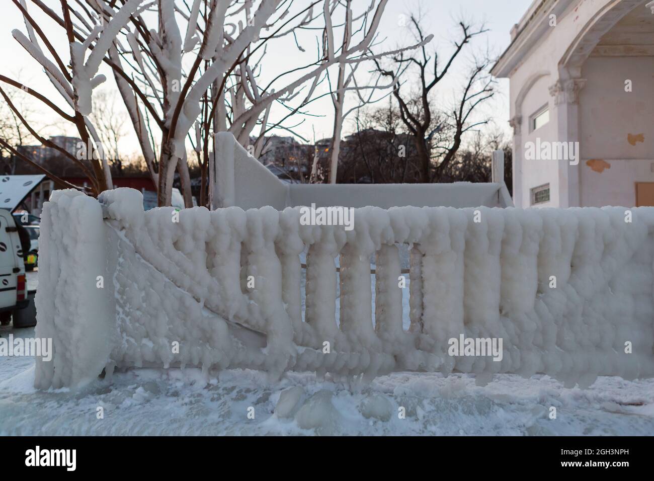 Icing. Winter natural disaster icing sea promenade after winter storm ...