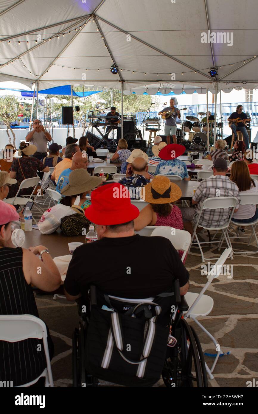 Greek band plays at the Long Beach Greek Festival in front of a crowd ...