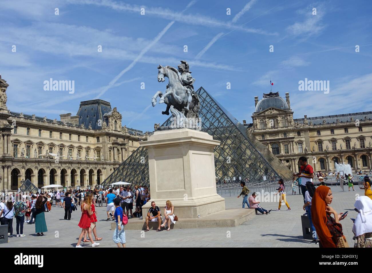 Crowds gather to enter the Louvre museum in Paris, France Stock Photo ...