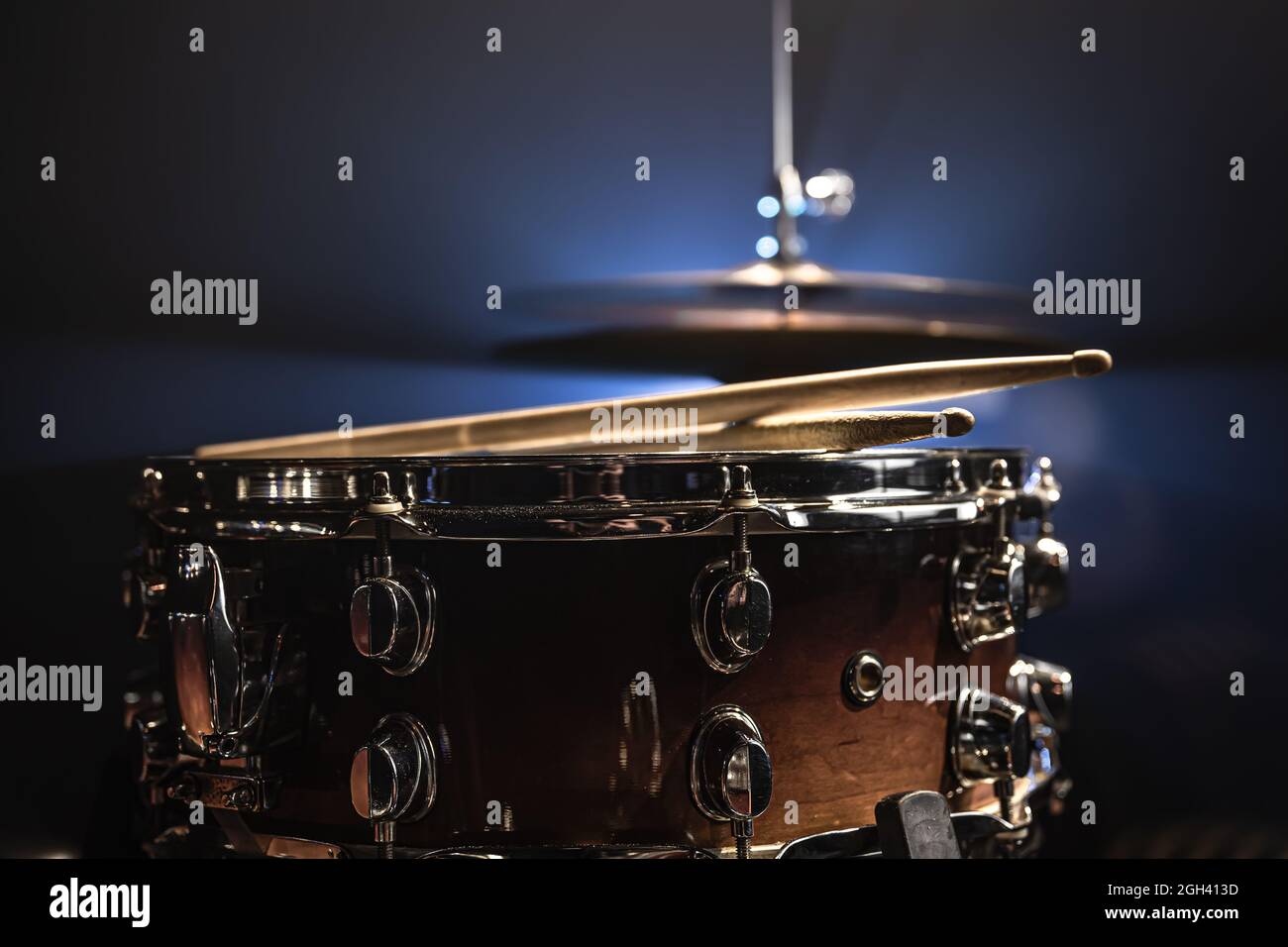 Snare drum, percussion instrument on a dark background with stage ...