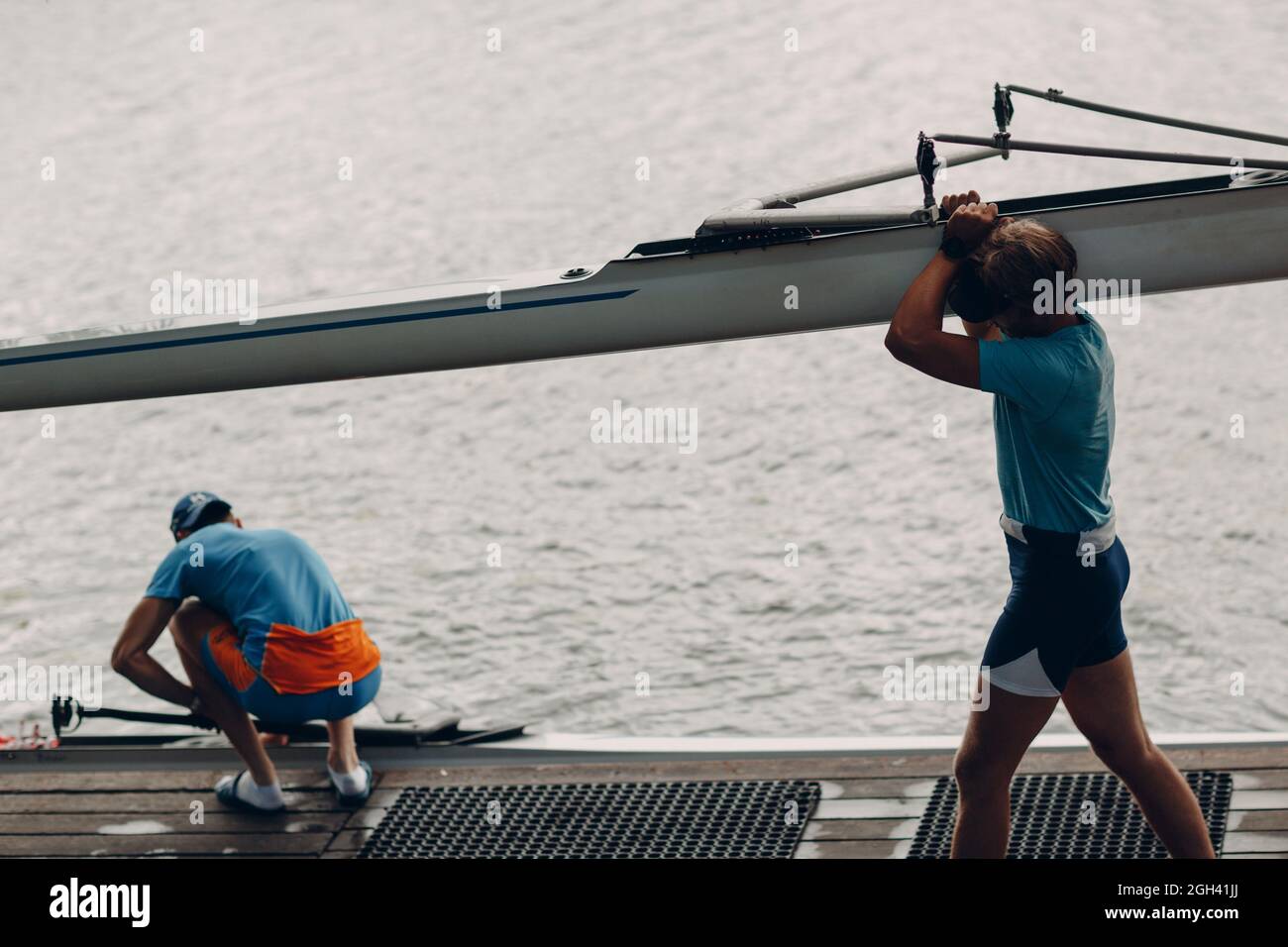 Man carrying canoe hi-res stock photography and images - Alamy