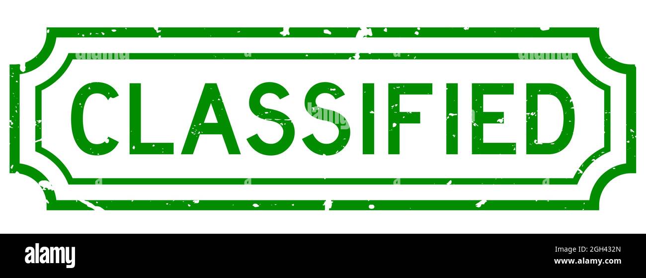 Grunge green classified word rubber seal stamp on white background ...