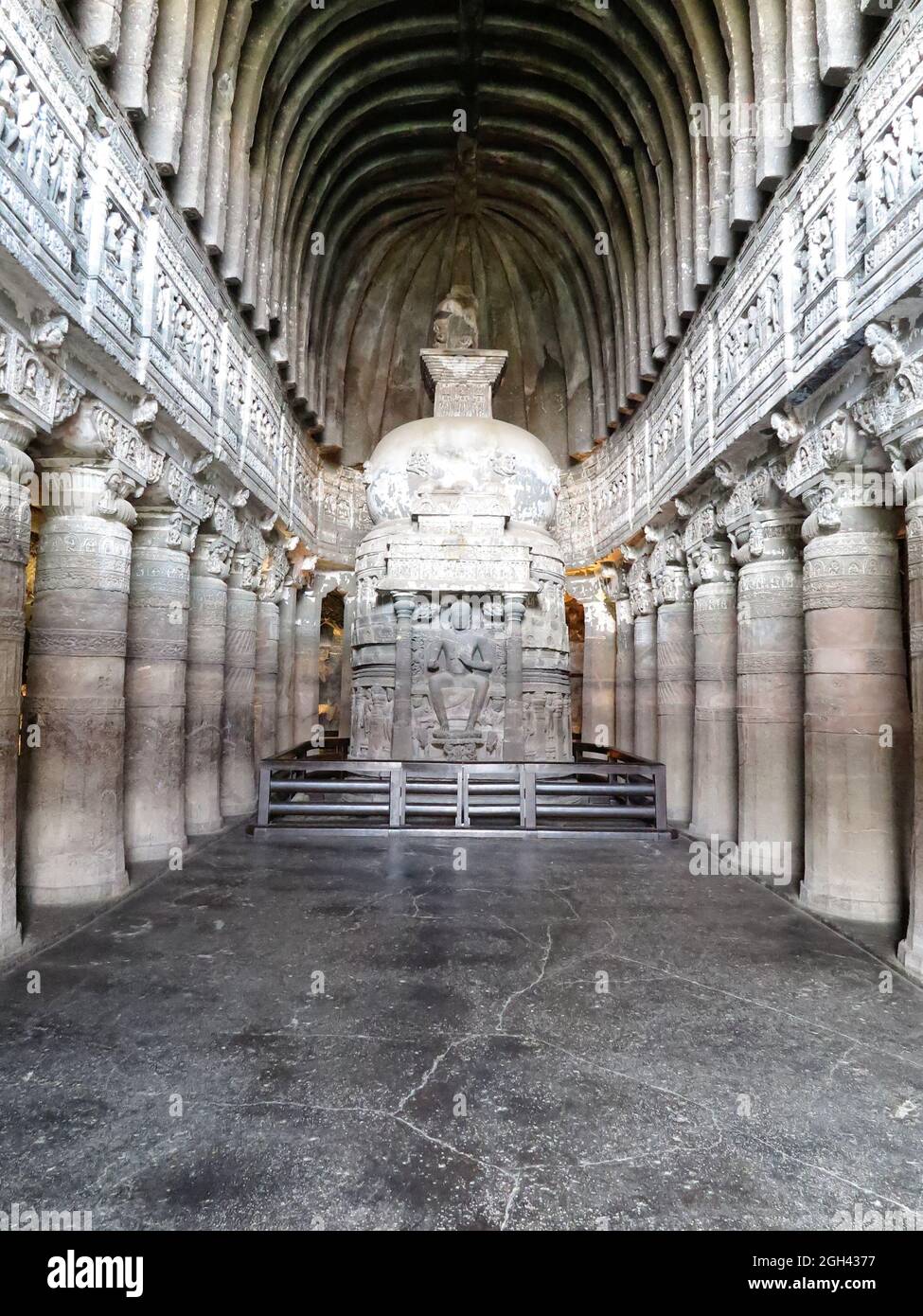 Ornate columns & vaulted ceiling in chaitya (shrine) hall with large ...