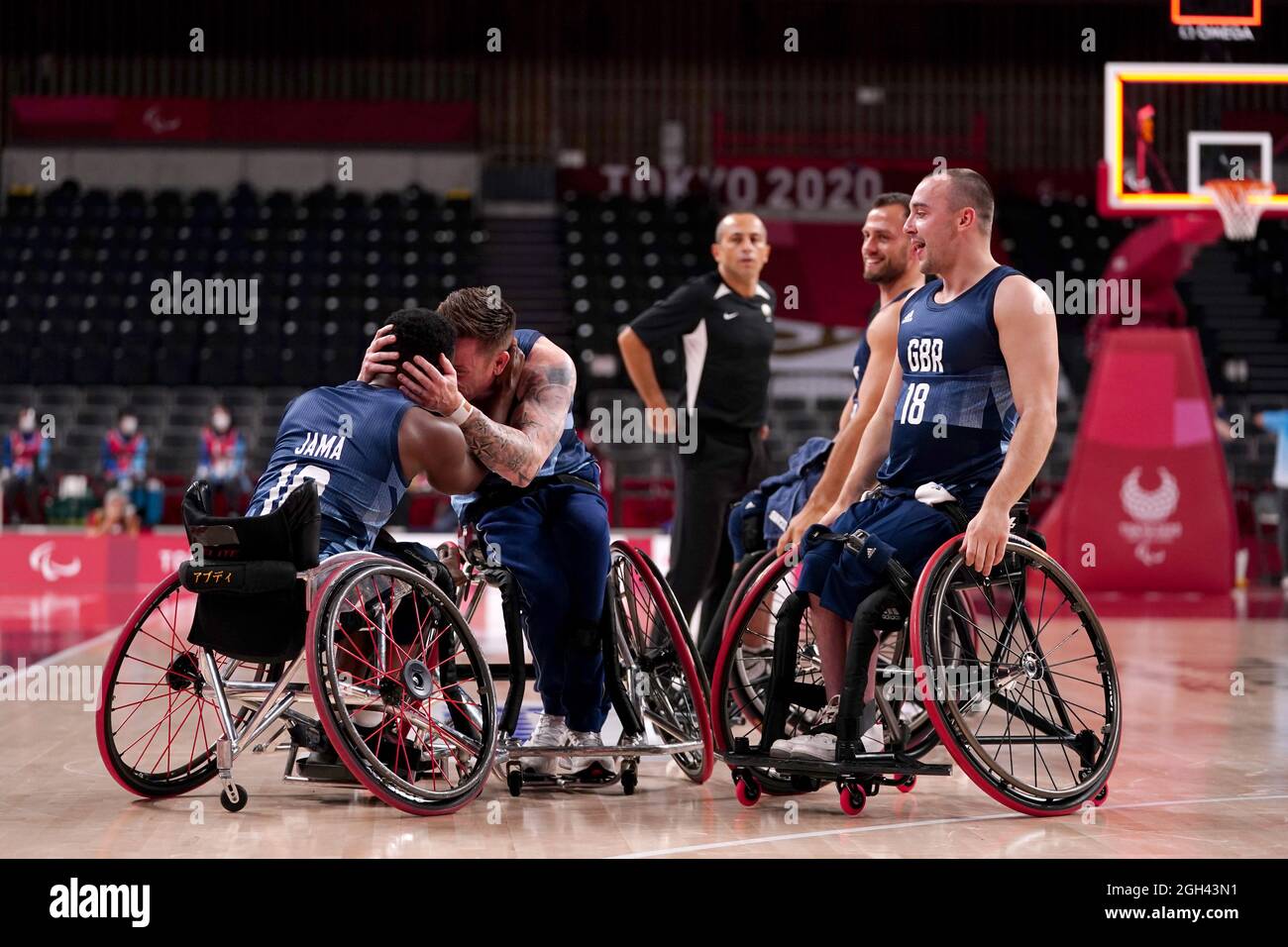 Great Britain's Terry Bywater celebrates with teammate Abdi Jama, (left ...