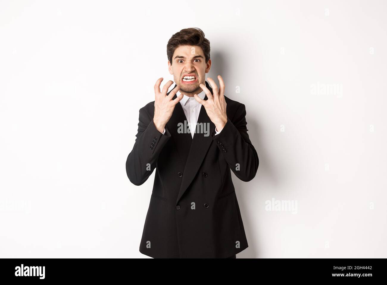 Image of angry businessman in suit, looking with furious expression and ...