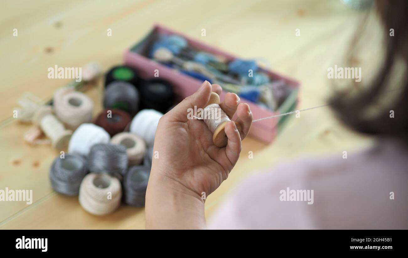 Embroider sewing by woman hand. Craft work and female hands. Handicraft ...