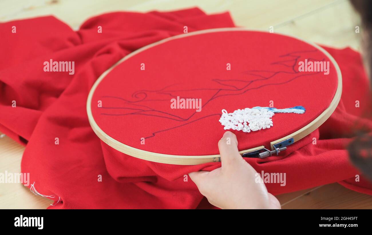 Embroider sewing by woman hand. Craft work and female hands. Handicraft ...