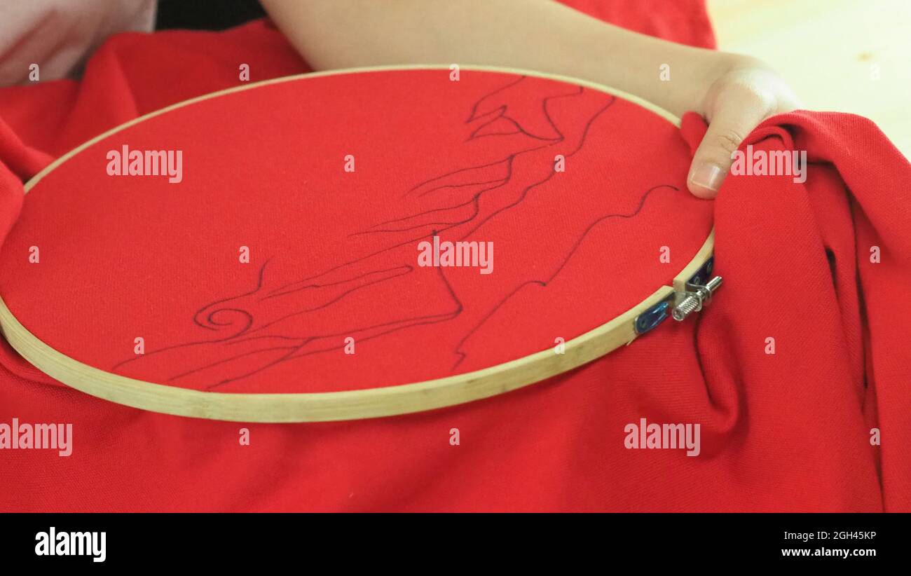 Embroider sewing by woman hand. Craft work and female hands. Handicraft ...