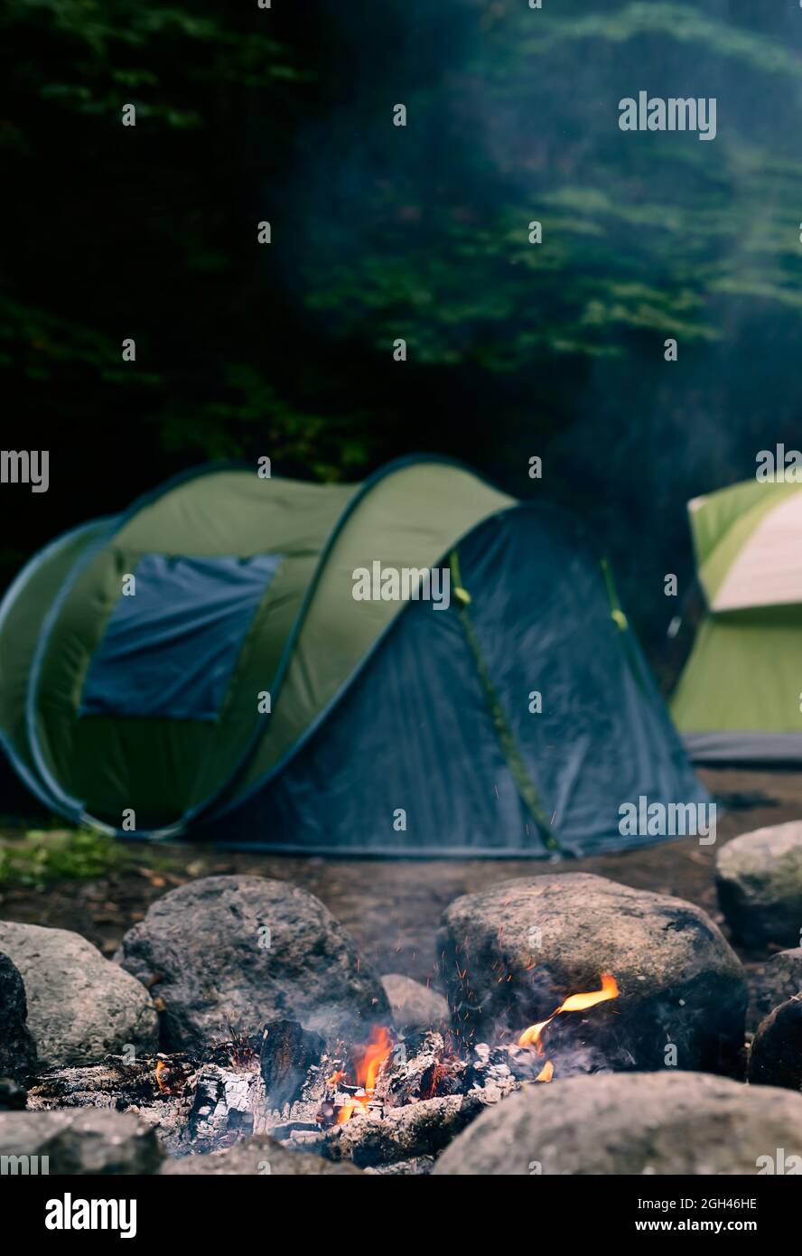 A burning fire at the camping site Stock Photo - Alamy