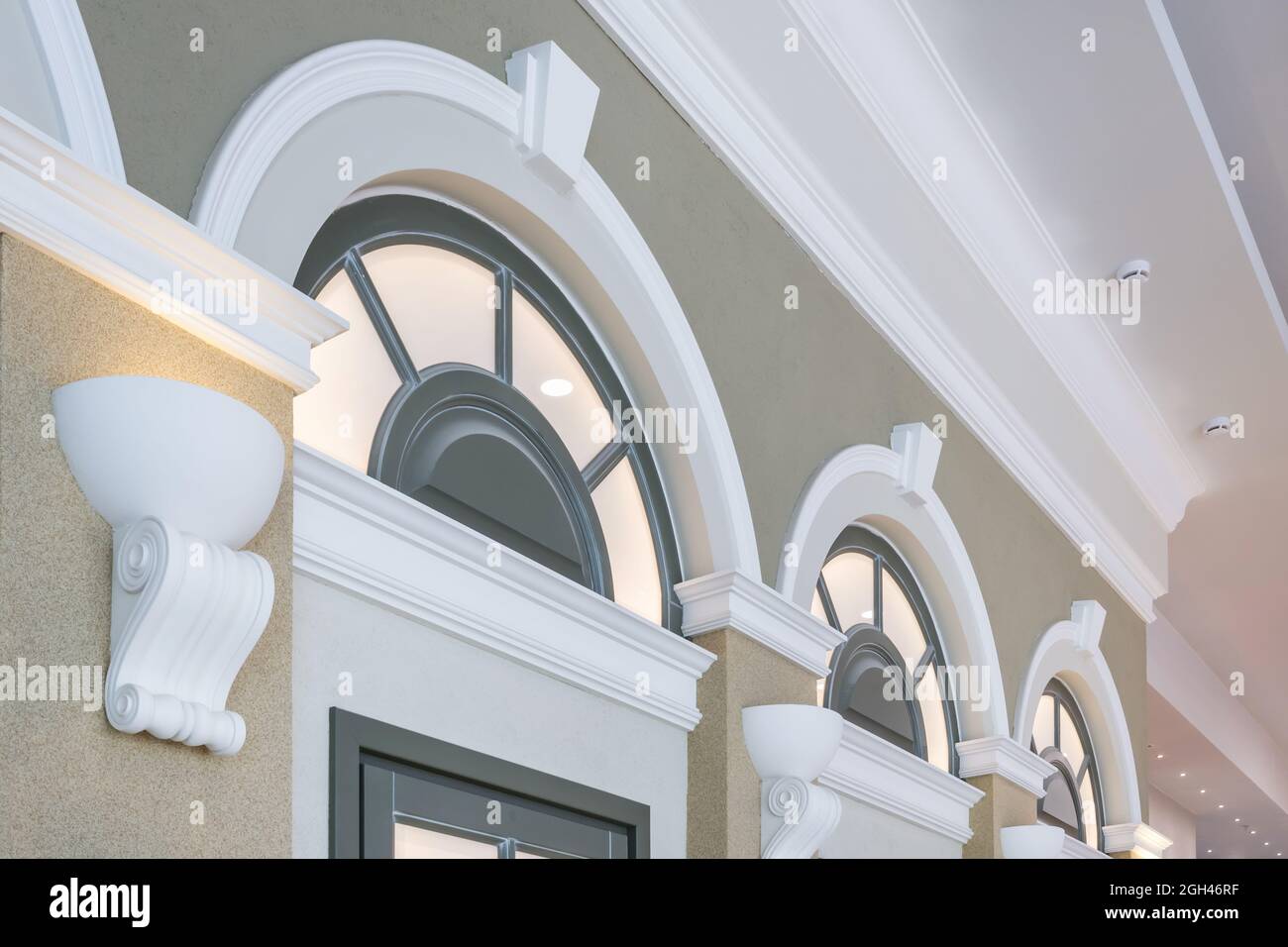 Detail of corner ceiling with intricate crown molding on column with ...