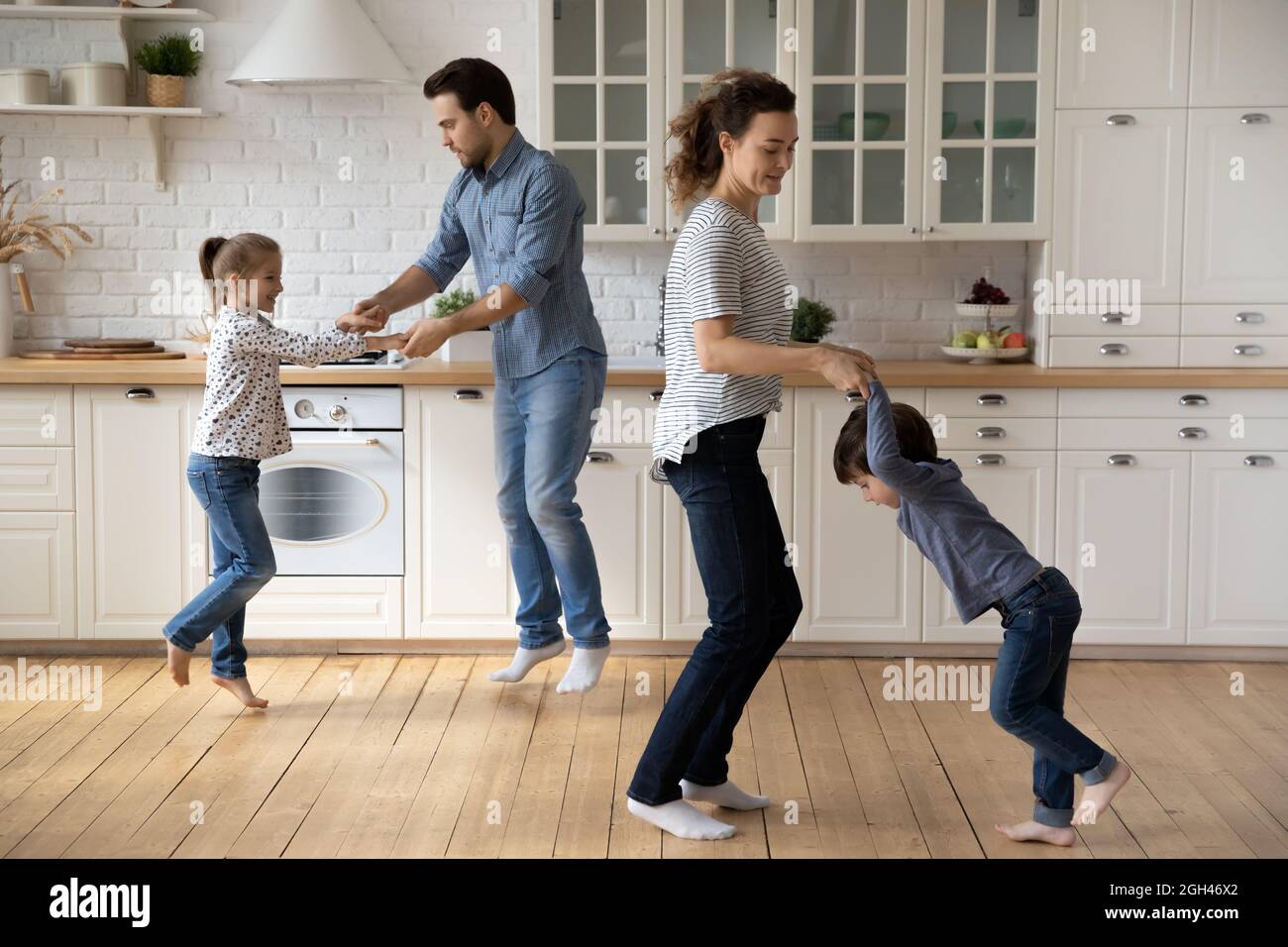 Excited family having fun due to moving into new house Stock Photo - Alamy