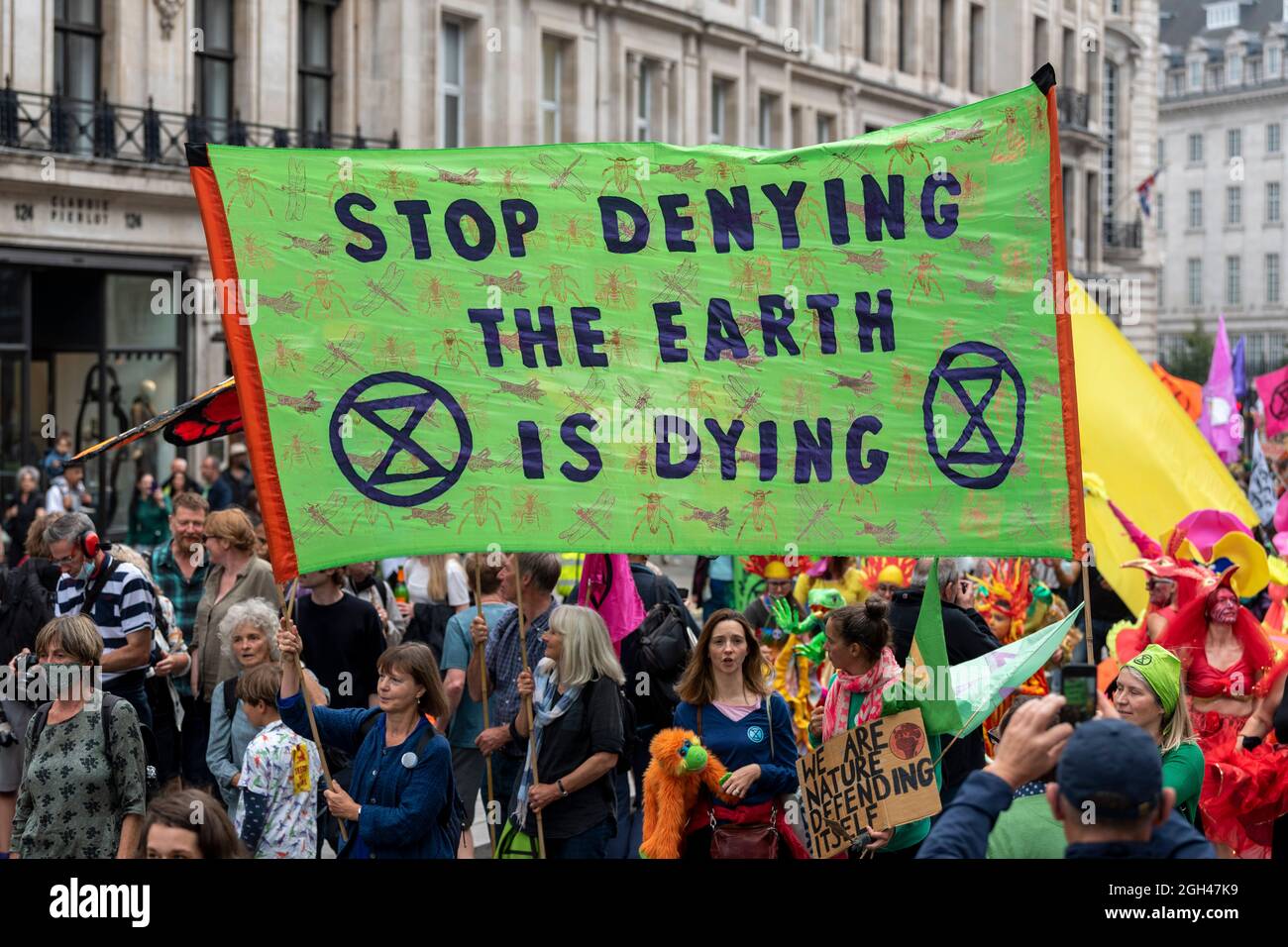 London, UK. 04th Sep, 2021. Protesters hold a banner with ‘Stop denying ...