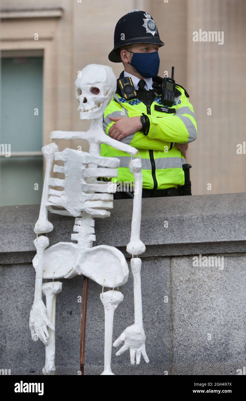 London, UK. 04th Sep, 2021. A police officer waits with a skeleton ...