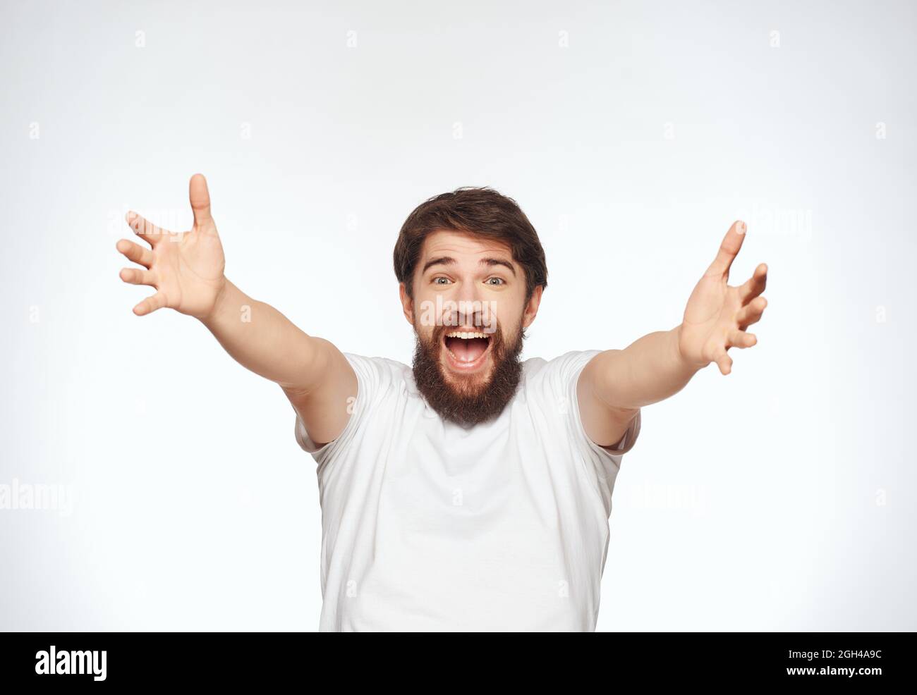 emotional man in a white t-shirt irritated facial expression yellow ...