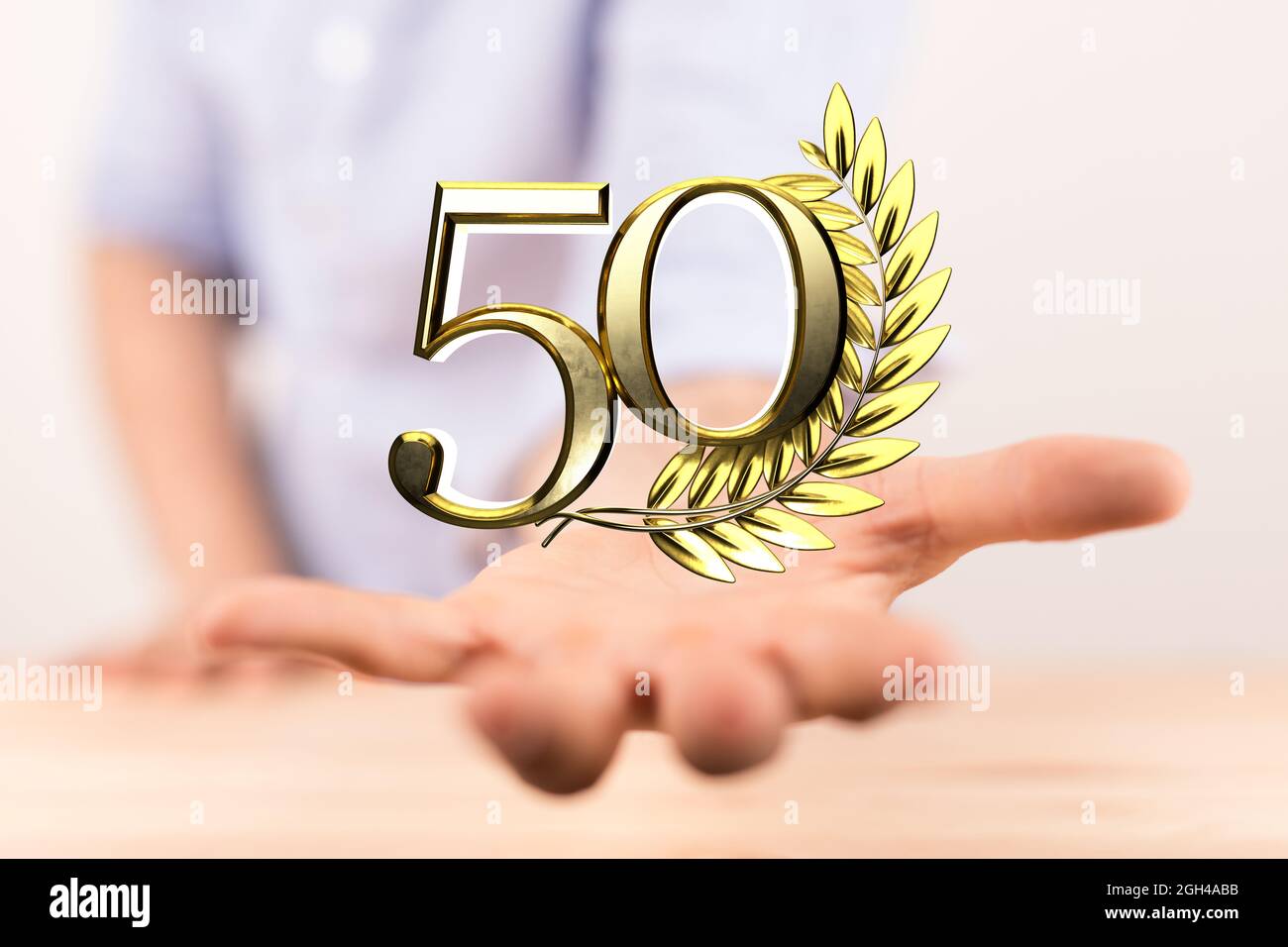 A digital 50 years anniversary award in a hand Stock Photo - Alamy