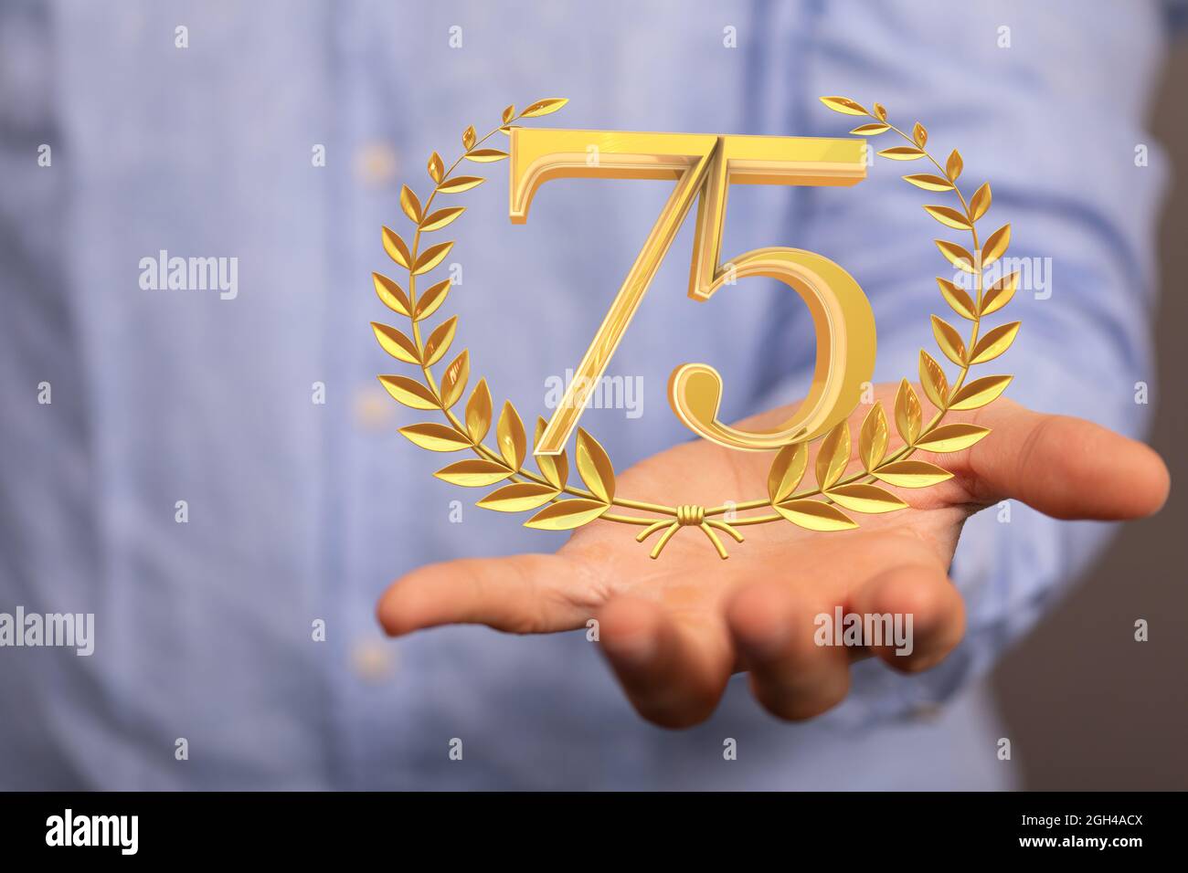 A digital 75 years anniversary award in a hand Stock Photo - Alamy