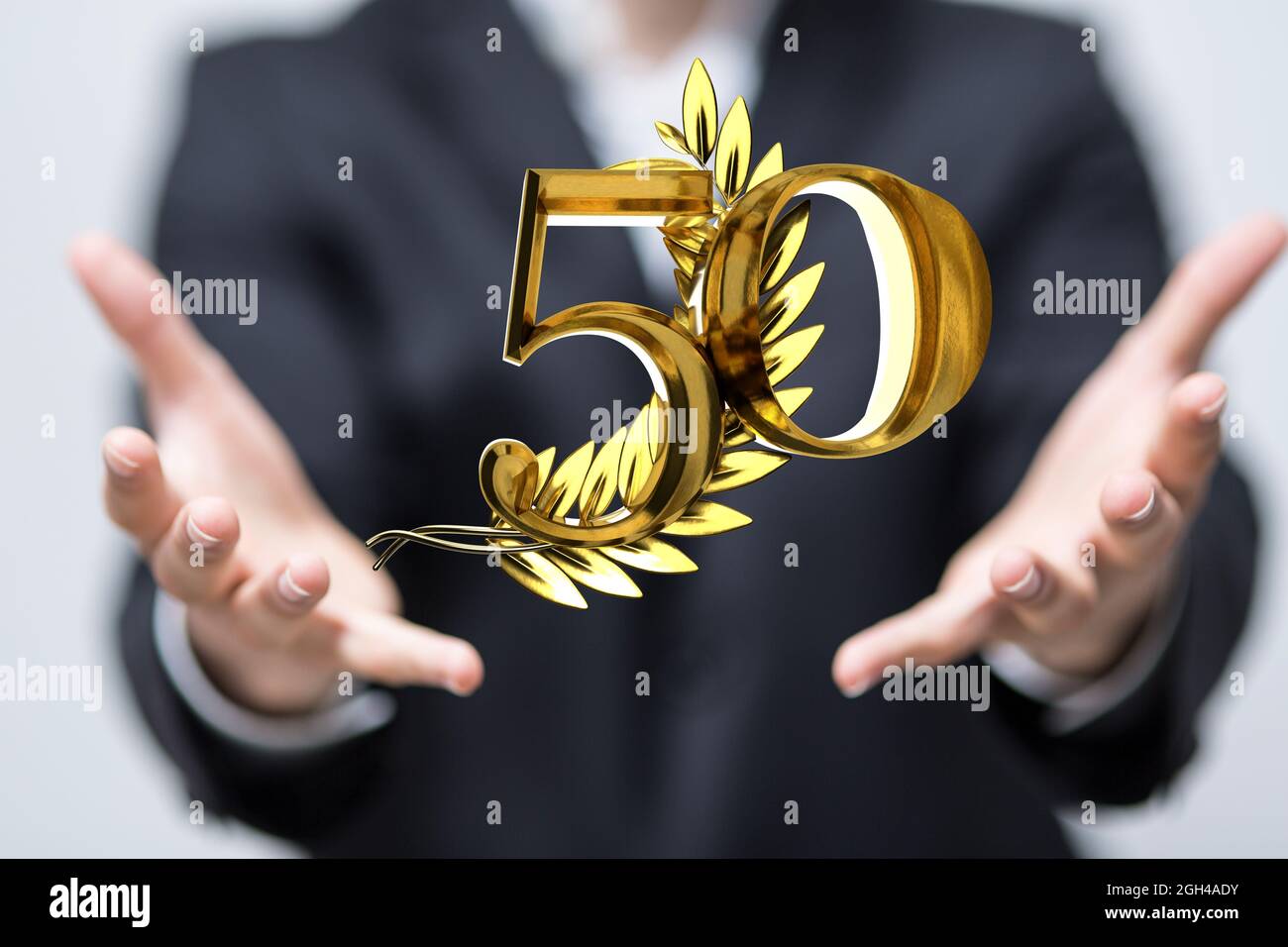 A digital 50 years anniversary award in a hand Stock Photo - Alamy