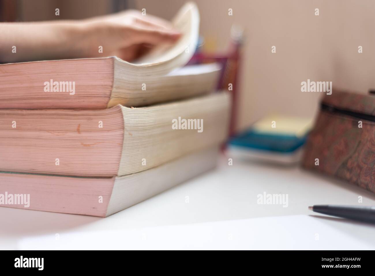 A shallow focus of big column books on the table Stock Photo - Alamy
