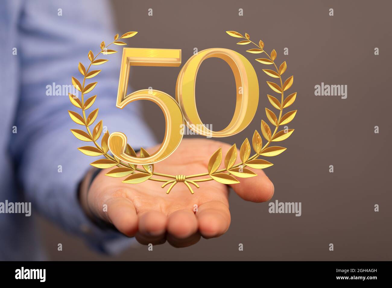 A digital 50 years anniversary award in a hand Stock Photo - Alamy