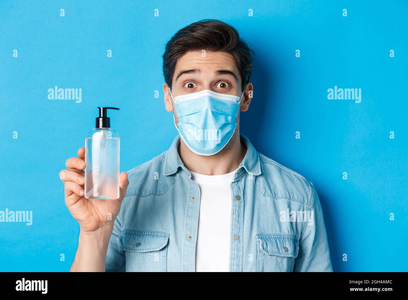 Concept of covid-19, pandemic and quarantine. Surprised guy in medical ...