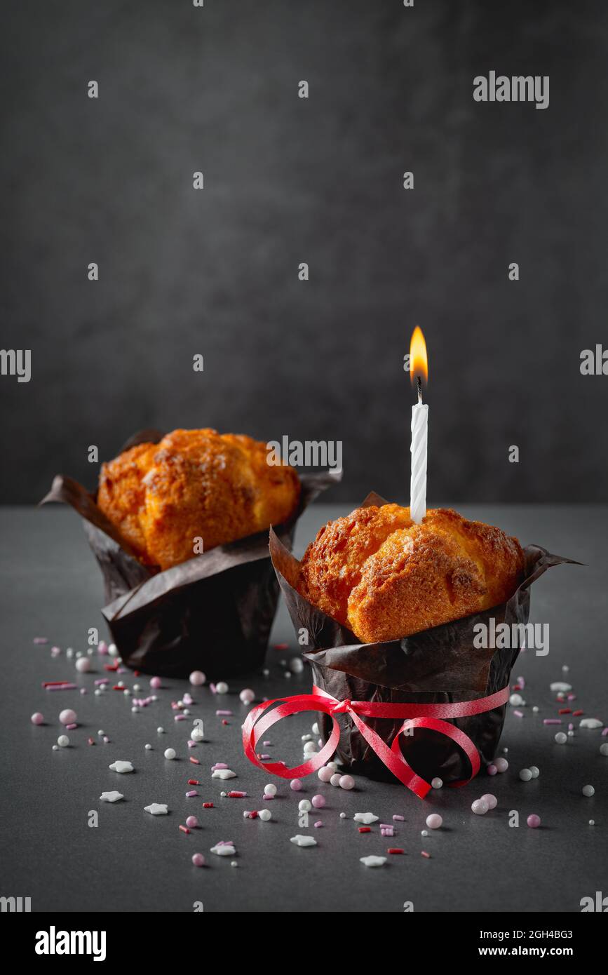 Birthday Muffin. Cupcake and pink ribbon, grey background with copy ...