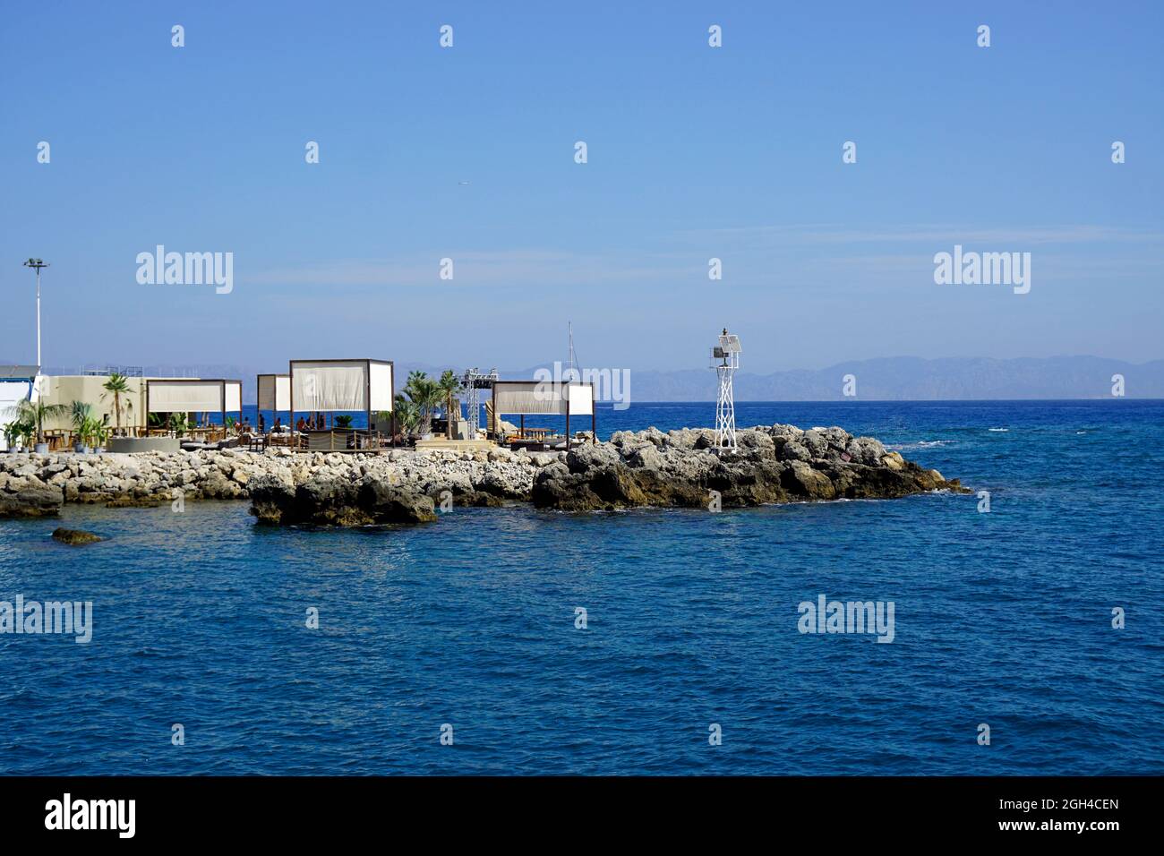 cozy beachclub on rhodes island in greece Stock Photo - Alamy