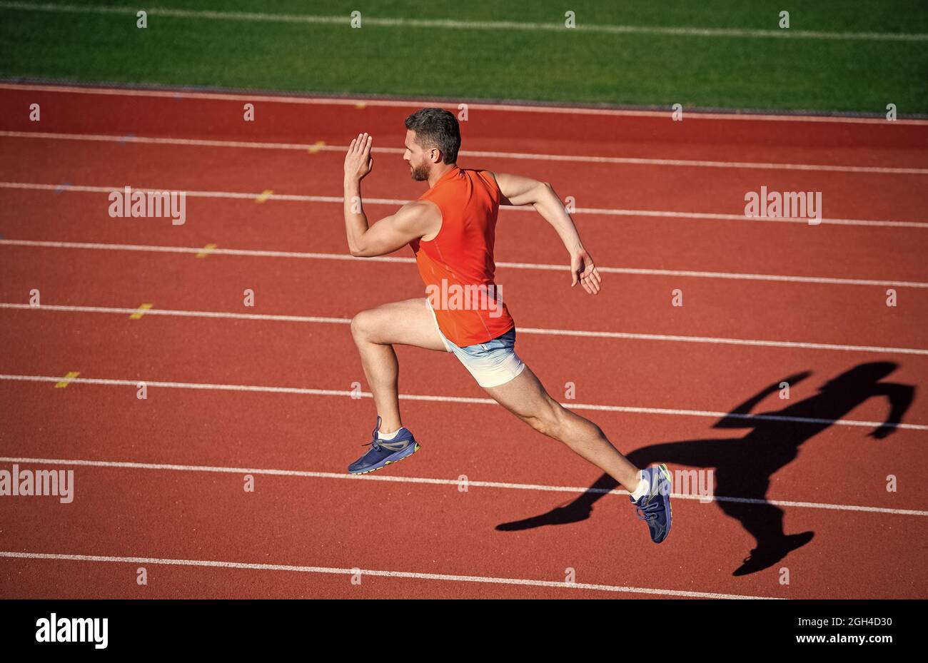 Energy inside. runner on racetrack. challenge and competition. marathon ...